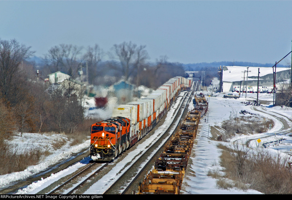 BNSF 7557 Caa be seen stretched out over the hills.